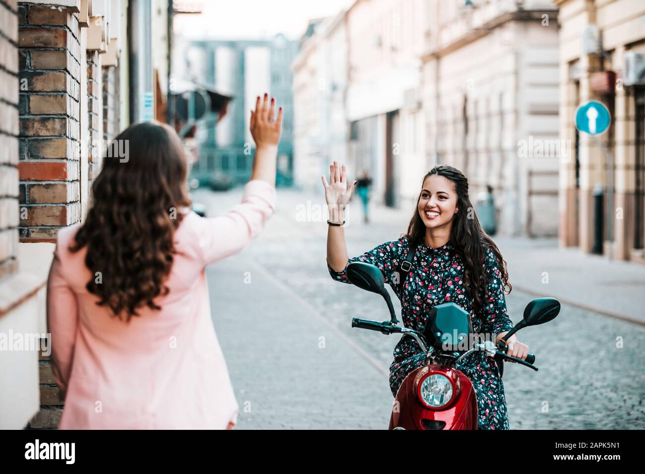 Waving hello to each other hi-res stock photography and images - Alamy