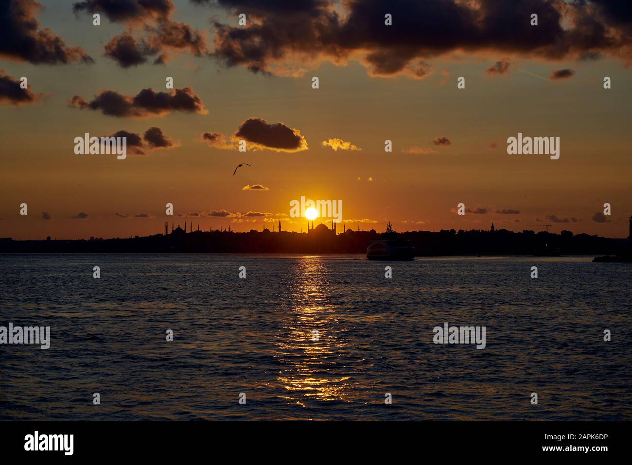 Beautiful sunset in Istanbul, Turkey. Sun is above silhouettes of Hagia ...