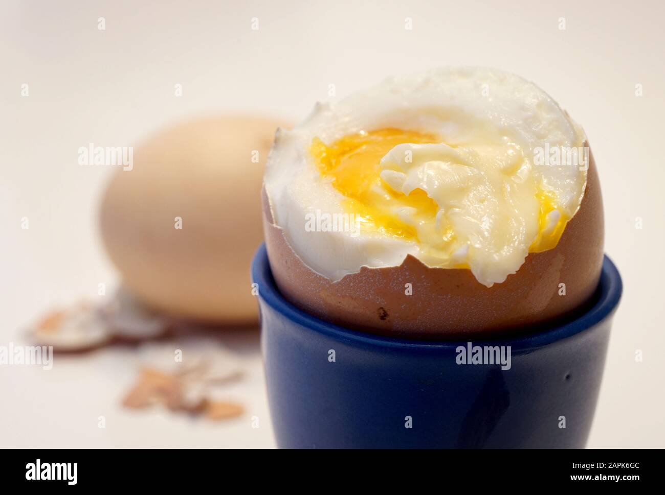 close-up of egg yolk of cooked egg with melted butter Stock Photo - Alamy