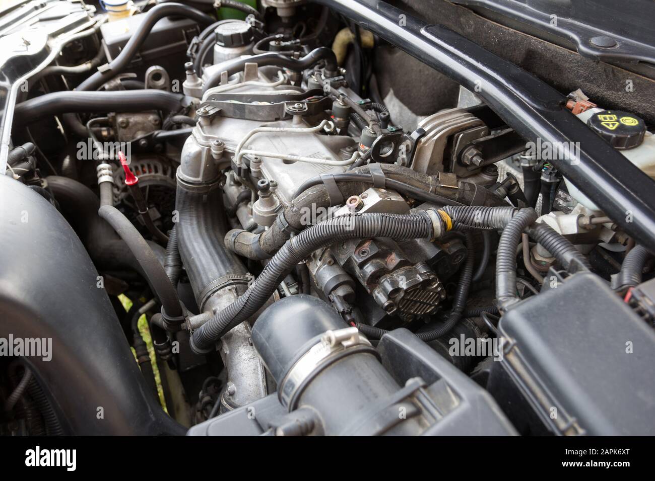 Diesel car engine without a decorative hood Stock Photo - Alamy