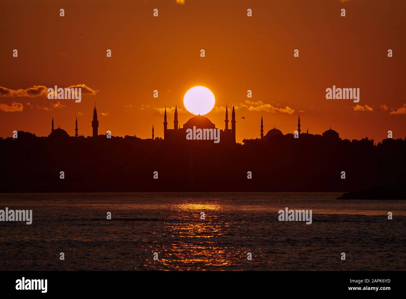 Beautiful sunset in Istanbul, Turkey. Sun is above silhouettes of Hagia ...
