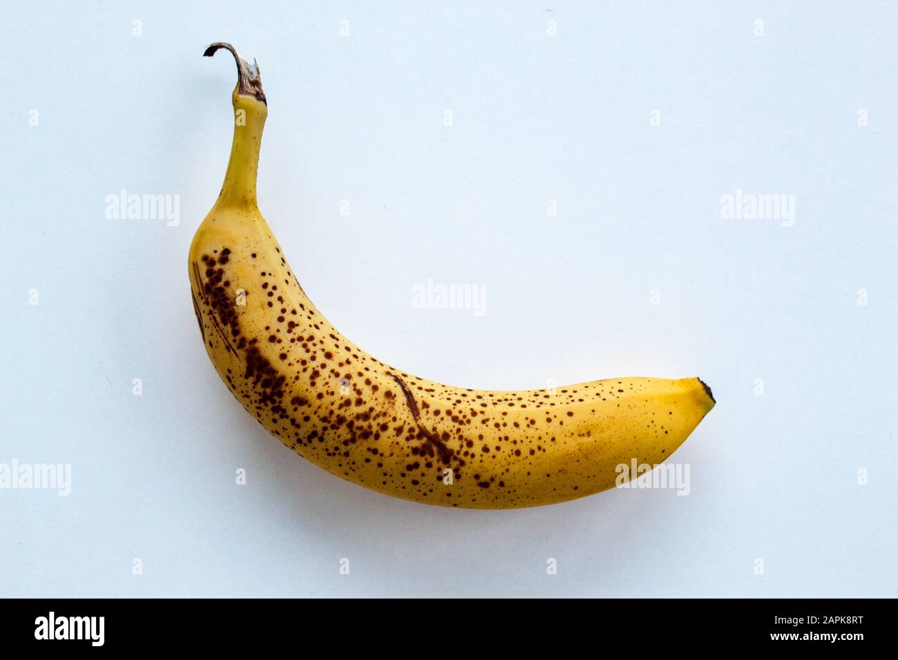 Single overripe banana isolated on white Stock Photo - Alamy