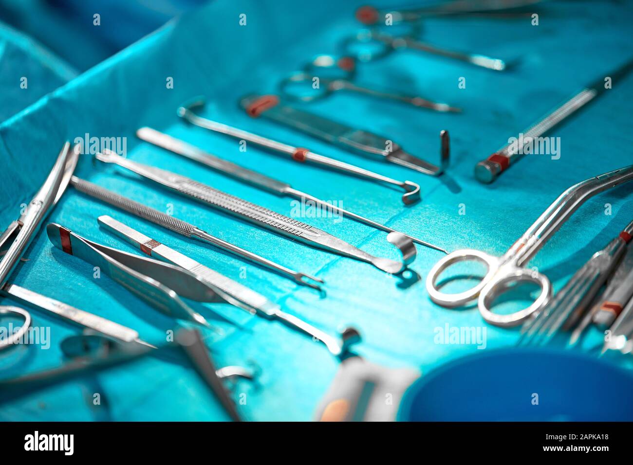 Sterile instruments on the operating table, blue light, real operating ...