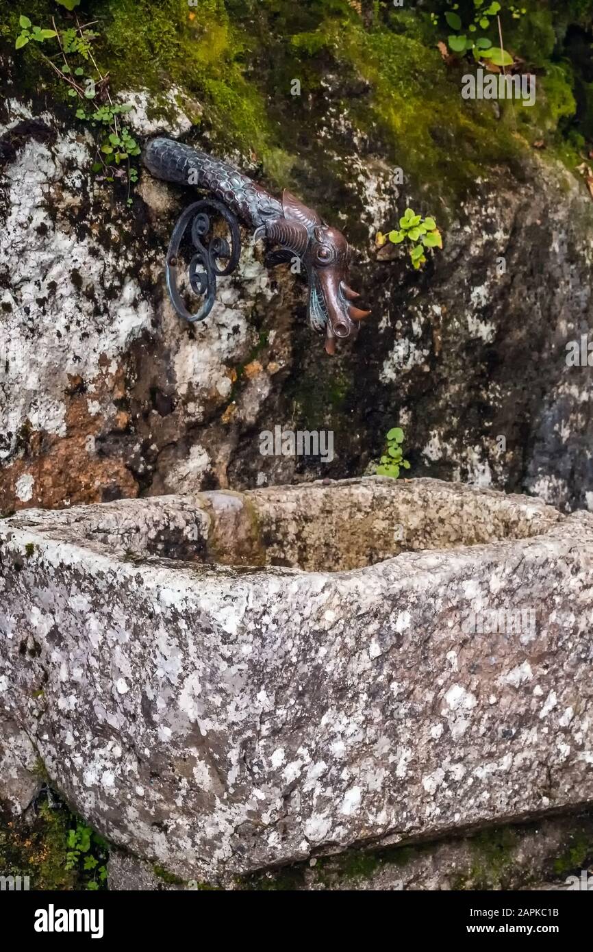 Dragon shaped water drainage in the famous Hallstatt mountain village ...