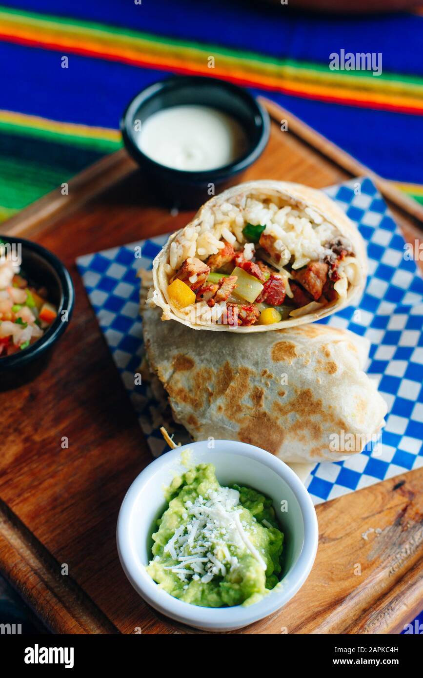 Vegetarian breakfast burrito with eggs and rice, sauces Stock Photo - Alamy