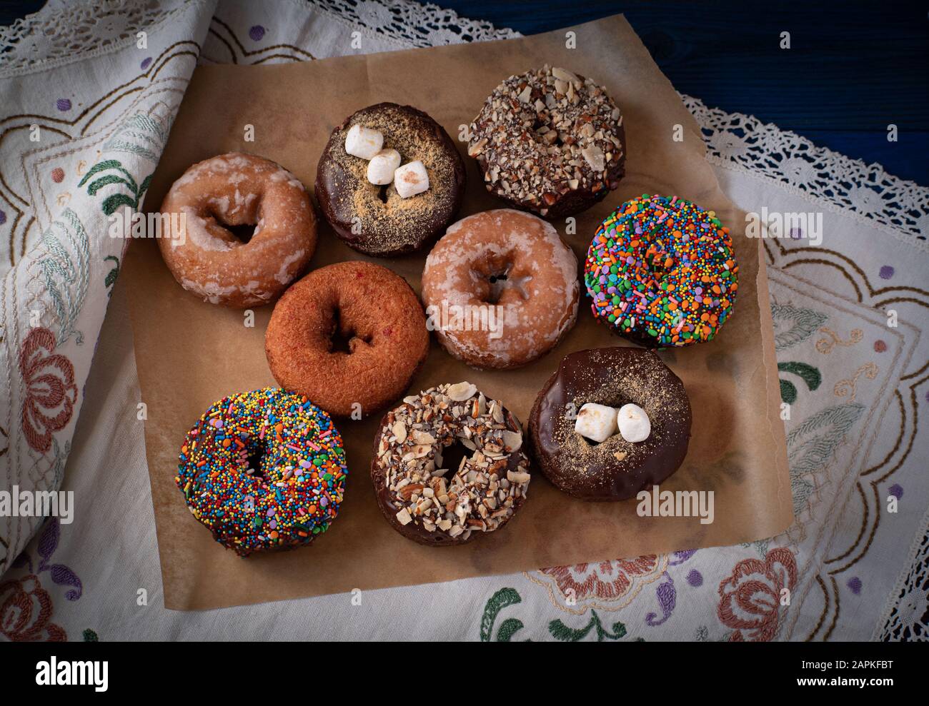 Beautiful doughnuts covered in chocolate glaze, sprinkles, marshmallows ...
