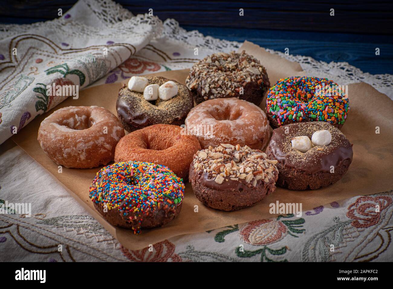 Beautiful doughnuts covered in chocolate glaze, sprinkles, marshmallows ...
