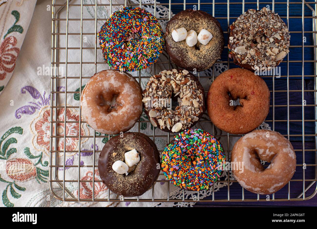 Beautiful doughnuts covered in chocolate glaze, sprinkles, marshmallows ...