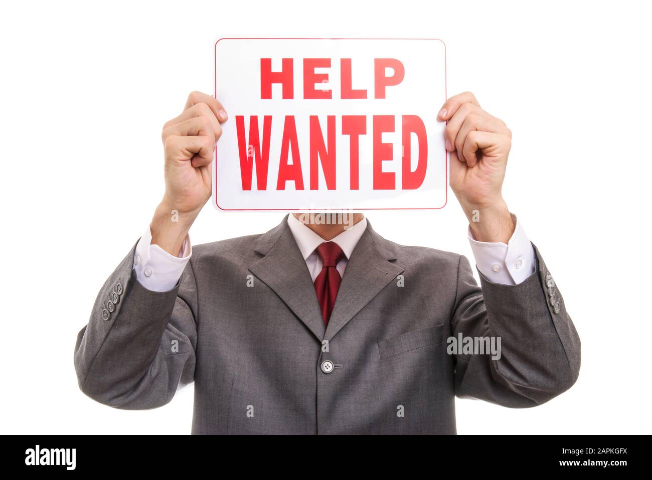 Unrecognizable businessman holding Help Wanted sign in front of his ...