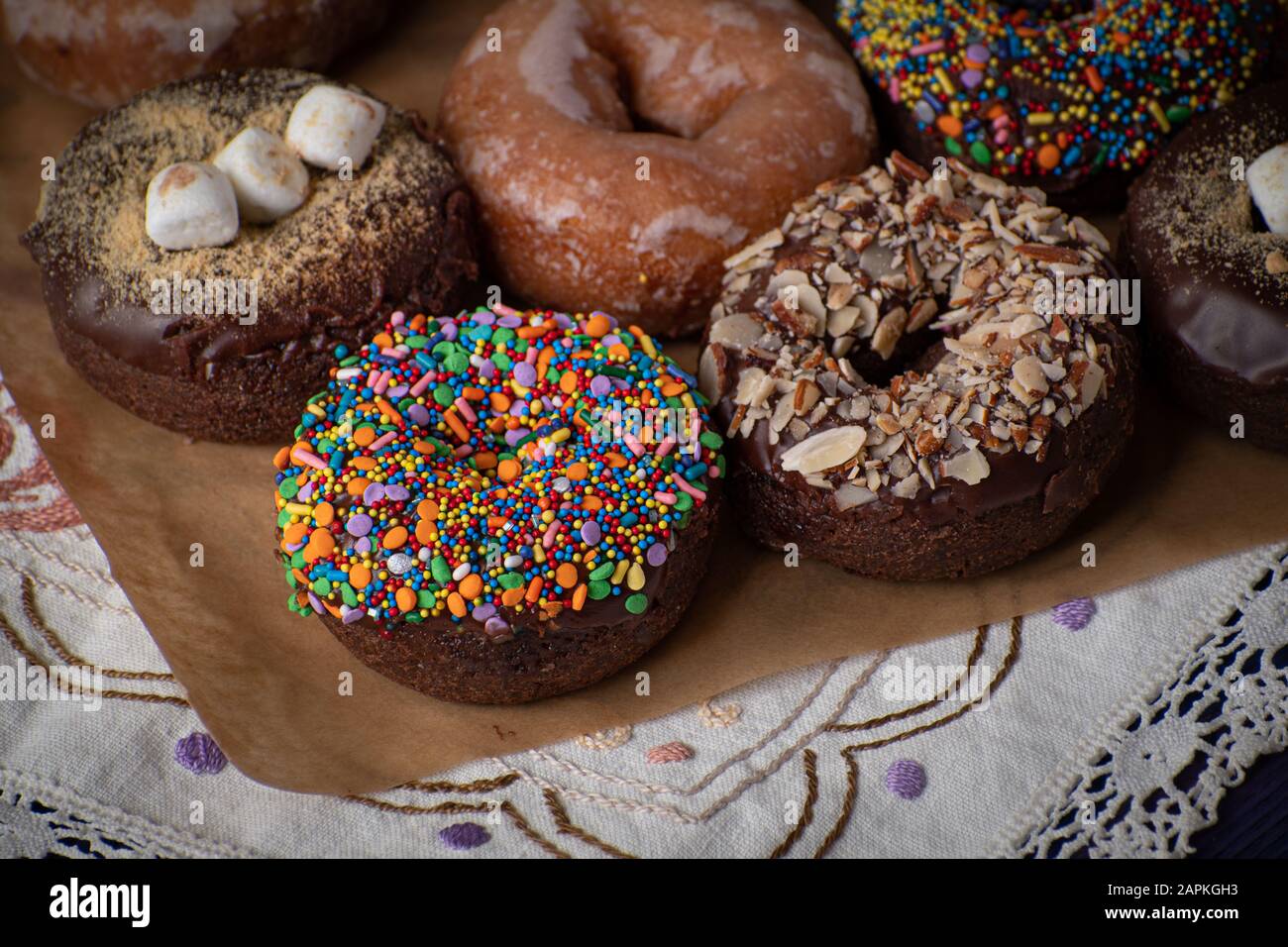 Beautiful doughnuts covered in chocolate glaze, sprinkles, marshmallows ...