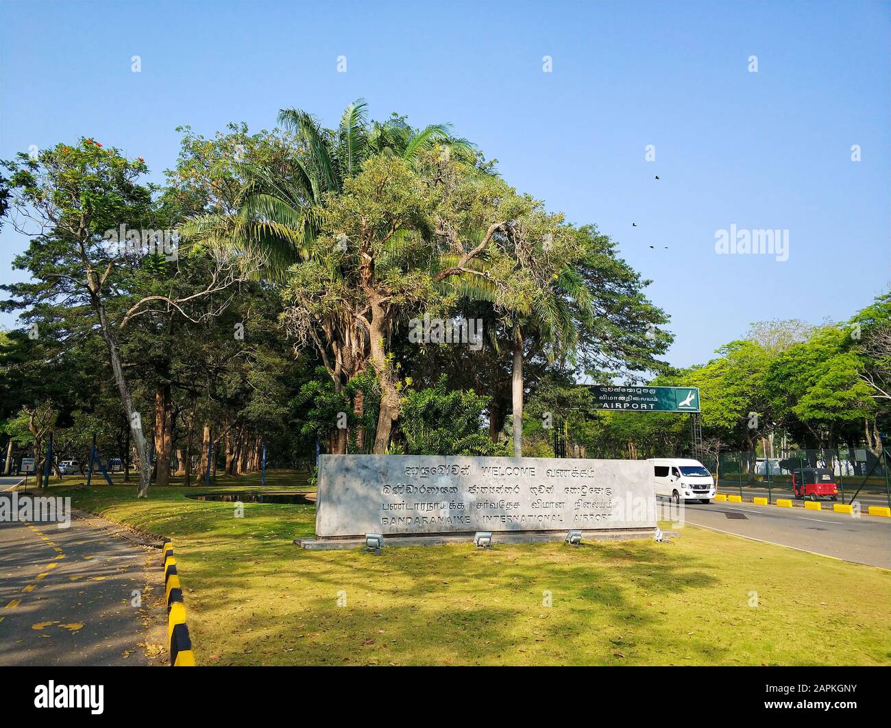 Road to Bandaranaike Airport. Stone pointer Stock Photo - Alamy