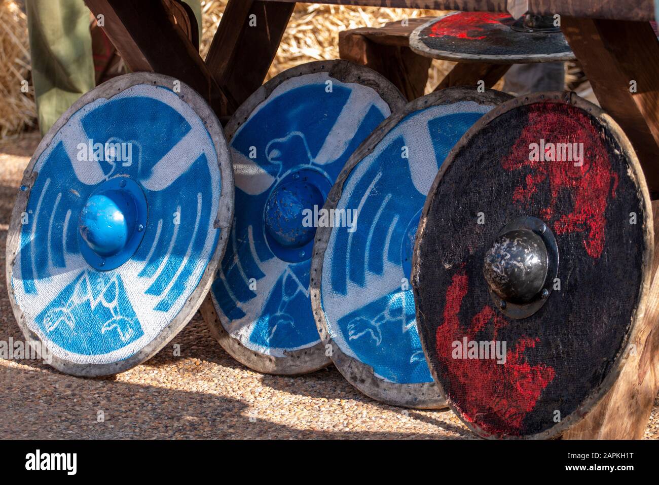 Round medieval wooden shields at display on a fair Stock Photo - Alamy