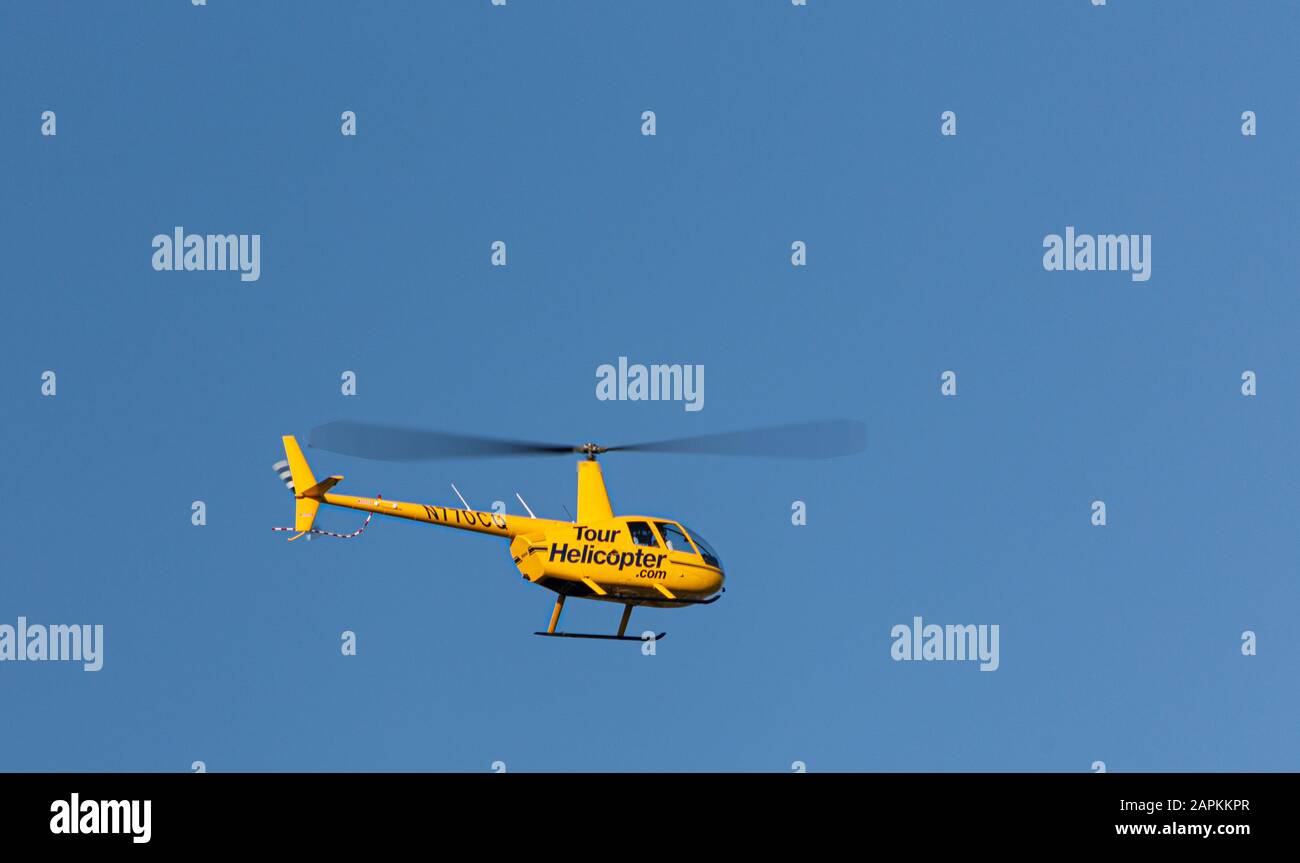 Yellow Tour Helicopter Stock Photo - Alamy