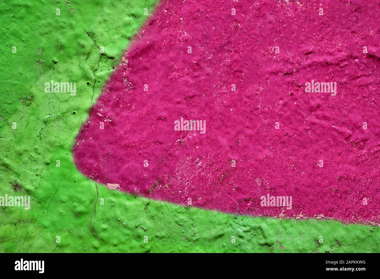 The abstract pattern on the wall is painted in juicy pink and green ...