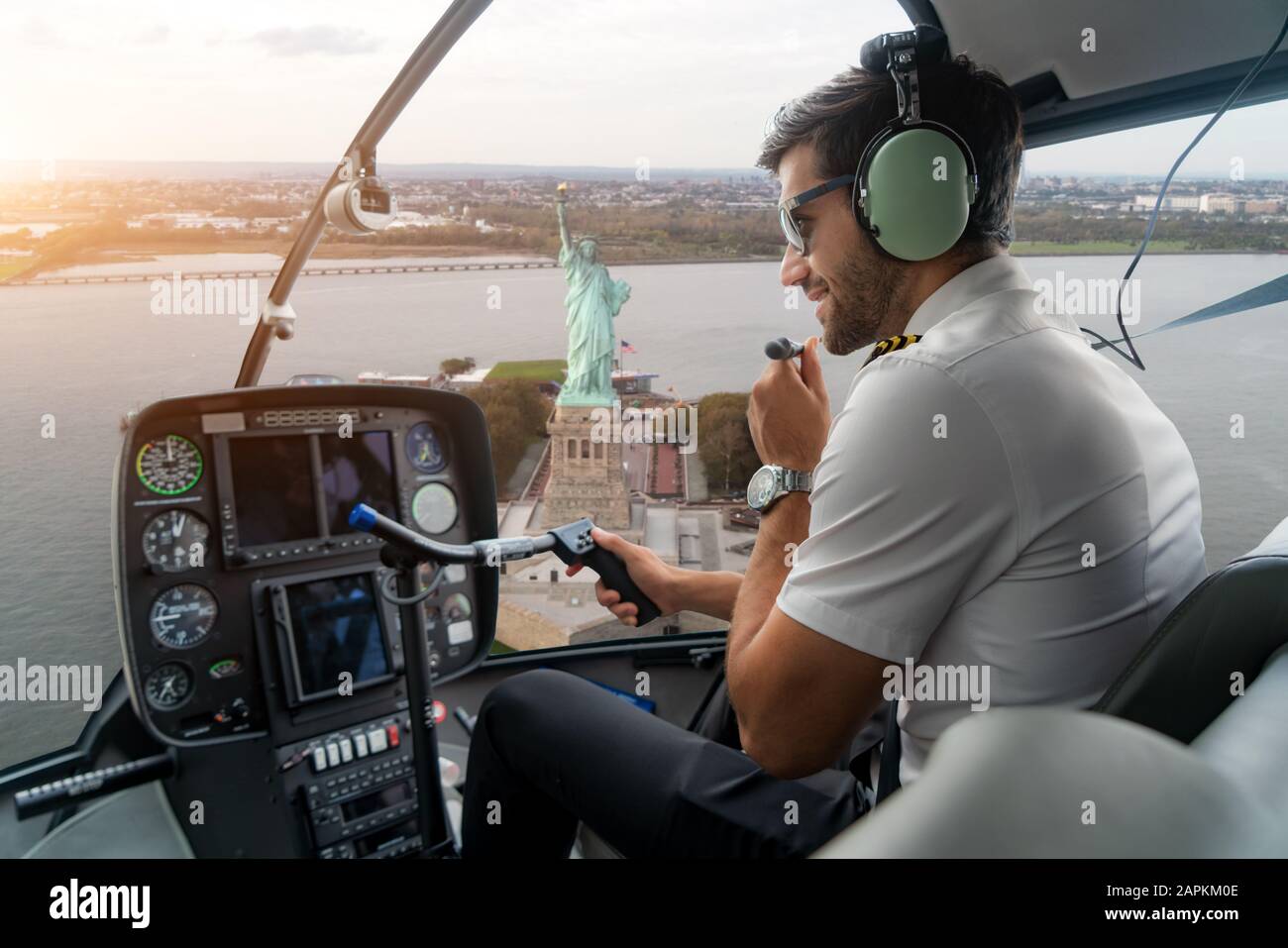 Helicopter cockpit with pilot arm and control console inside the cabin ...