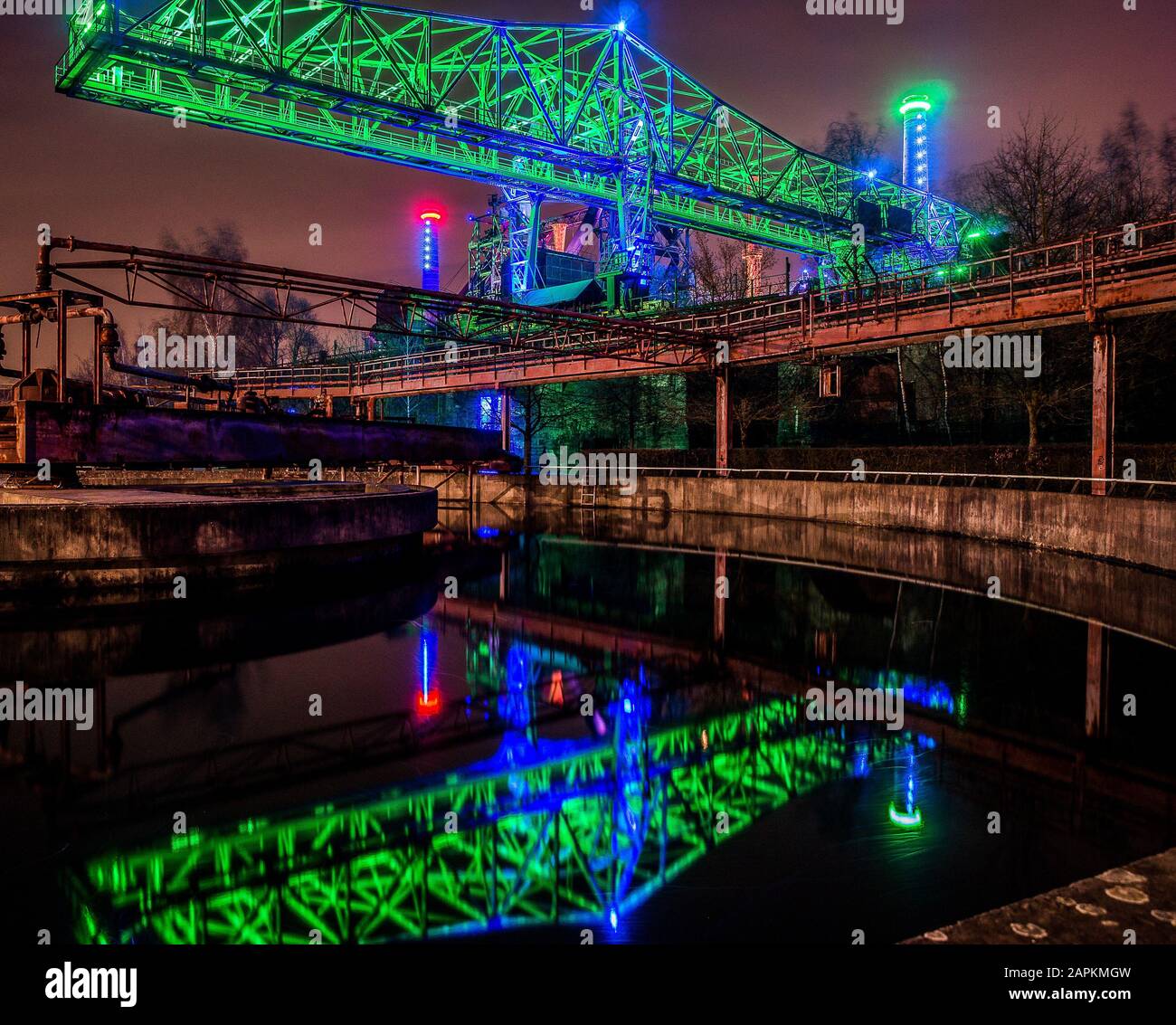 Stunning view of towers with neon lights of a park in Germany at night ...