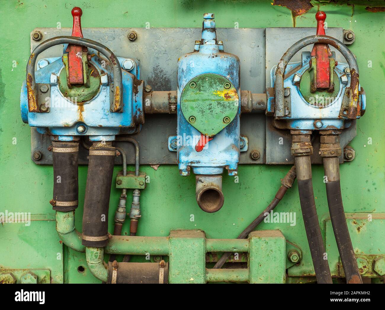Wide shot of a vintage engine on a green background Stock Photo - Alamy