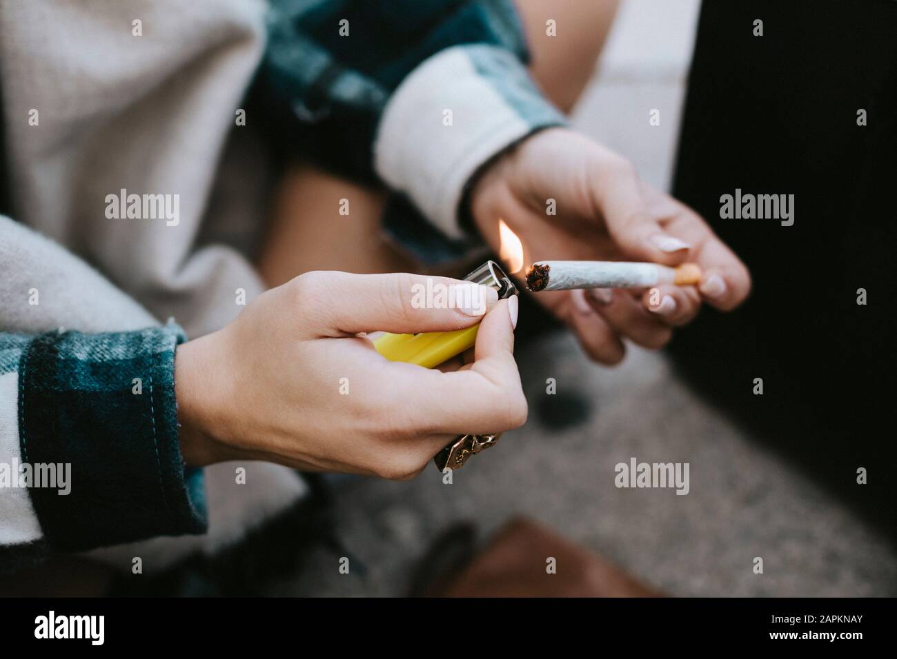 Close up hands lighting joint hi-res stock photography and images - Alamy
