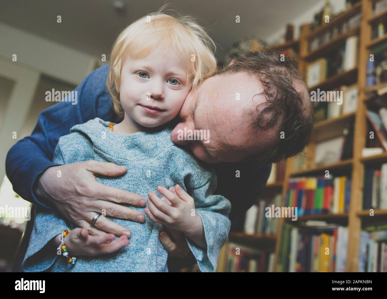 Father hugging his little daughter at home Stock Photo - Alamy