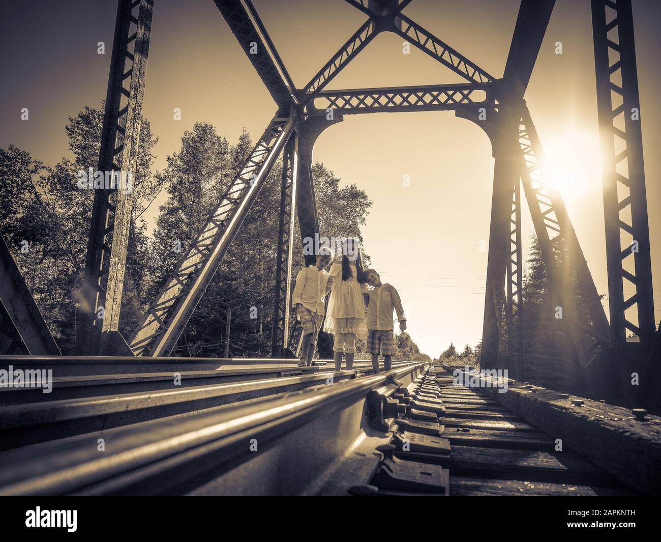 Kids Walk On Railroad Track High Resolution Stock Photography and ...
