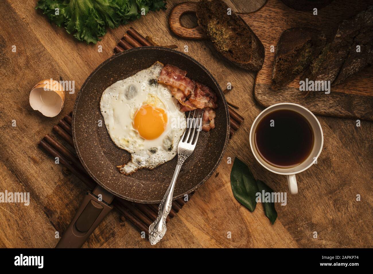 Russia, Saint Petersburg, Fried egg and bacon on frying pan Stock Photo ...