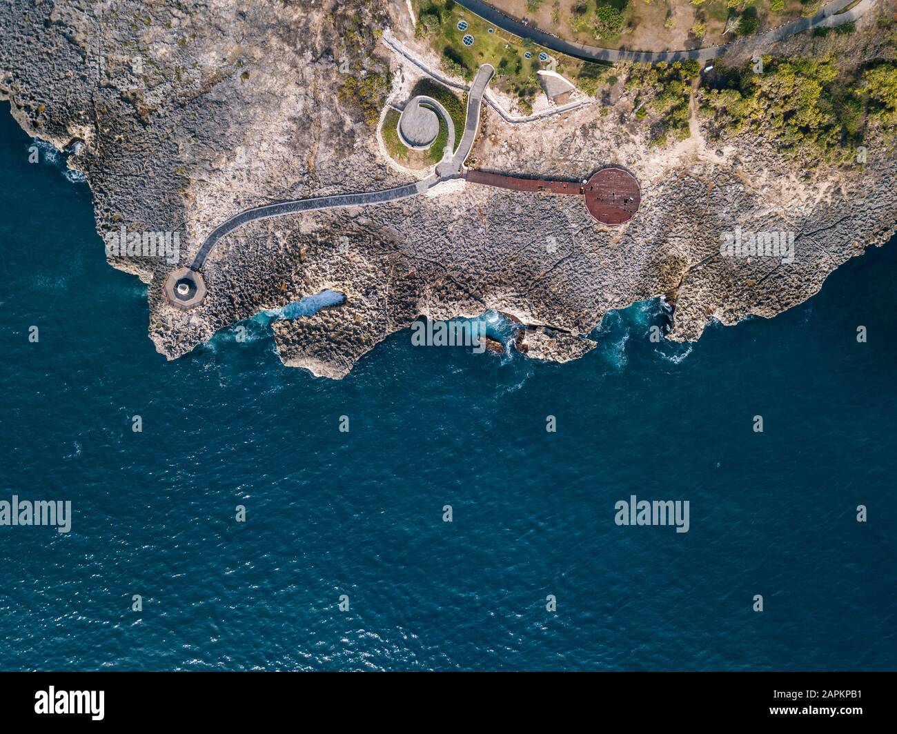 Indonesia, Bali, Nusa Dua, Aerial view of path and buildings at ocean ...