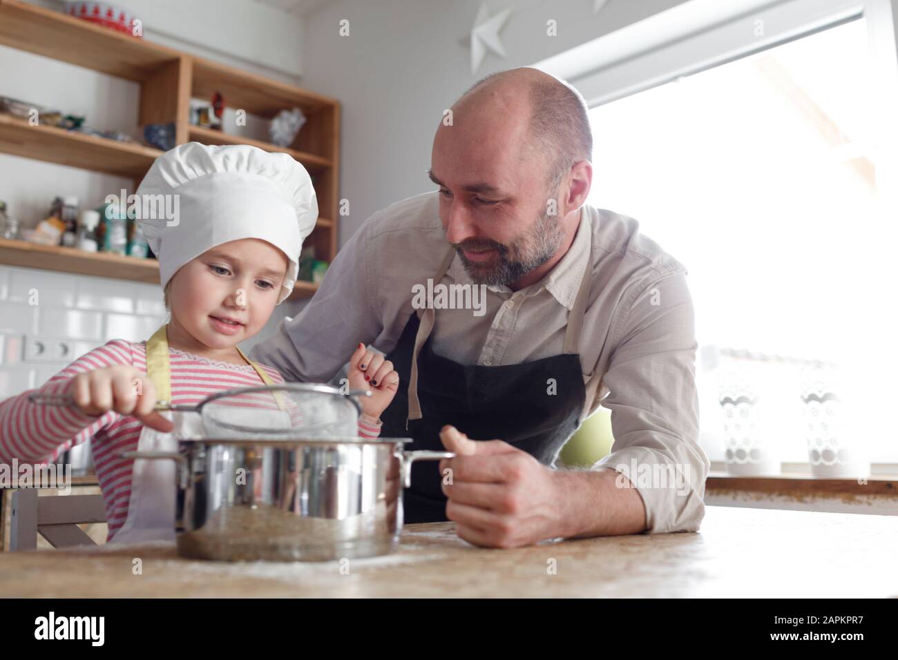 Father and daughter cooking in the kitchen Stock Photo - Alamy