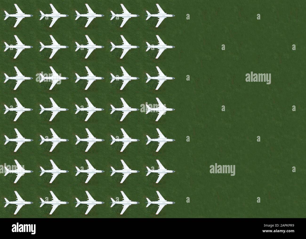 Aerial view of rows of airplanes standing on green grass Stock Photo ...