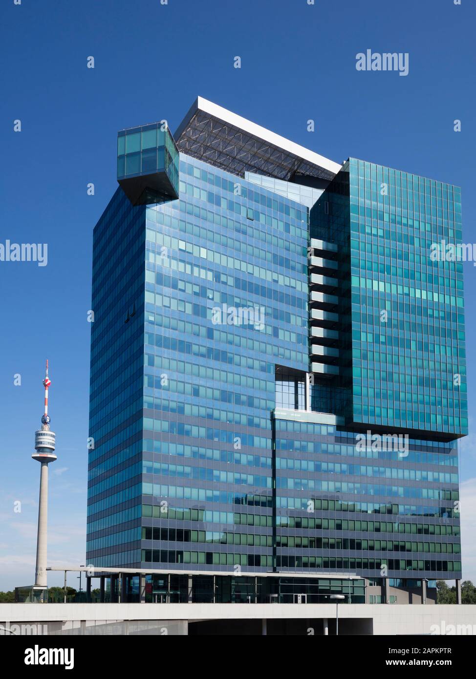Austria, Vienna, Office skyscraper with Danube Tower in background ...