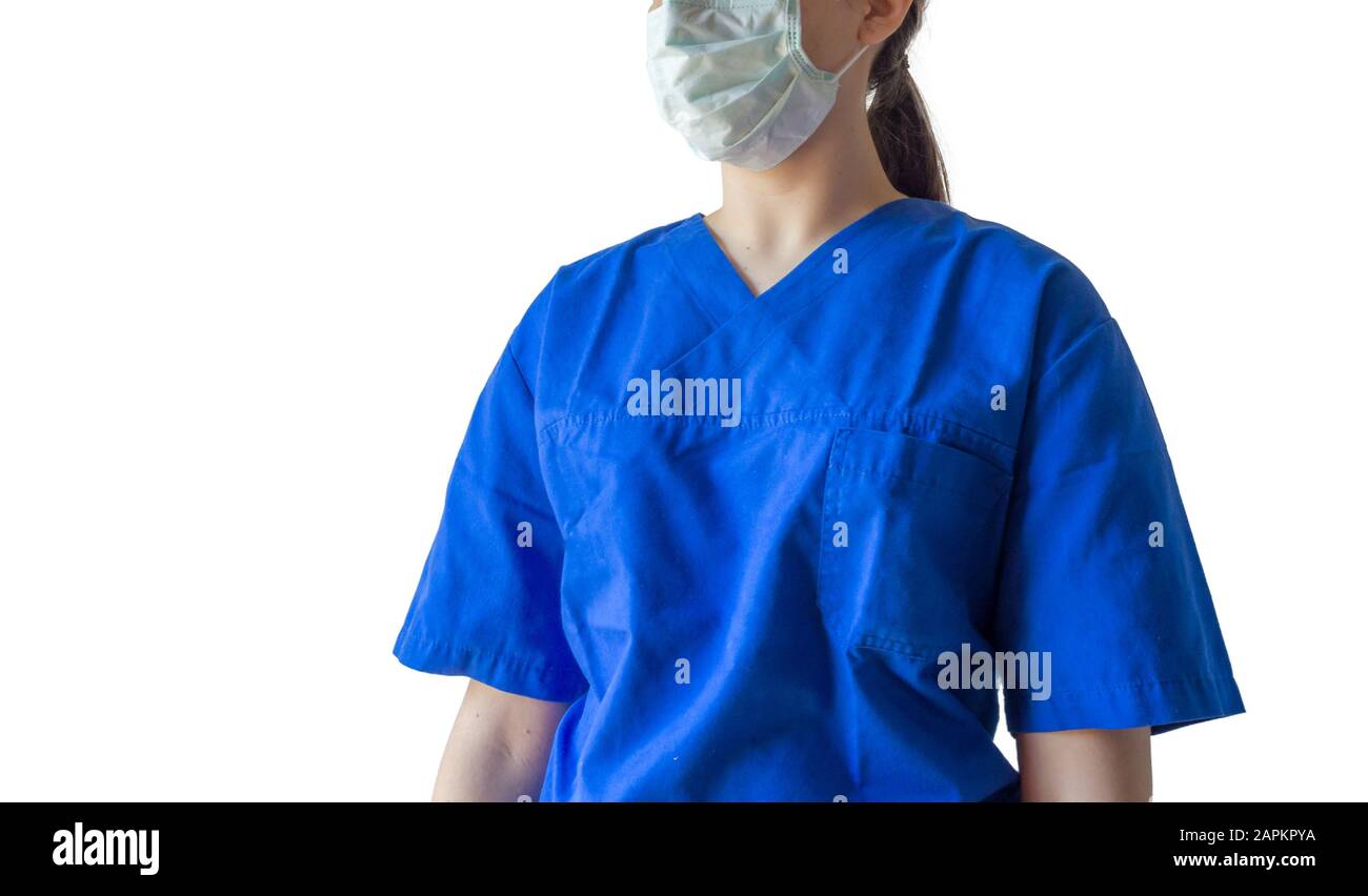 Young female doctor wearing a blue medical uniform and a mask isolated ...