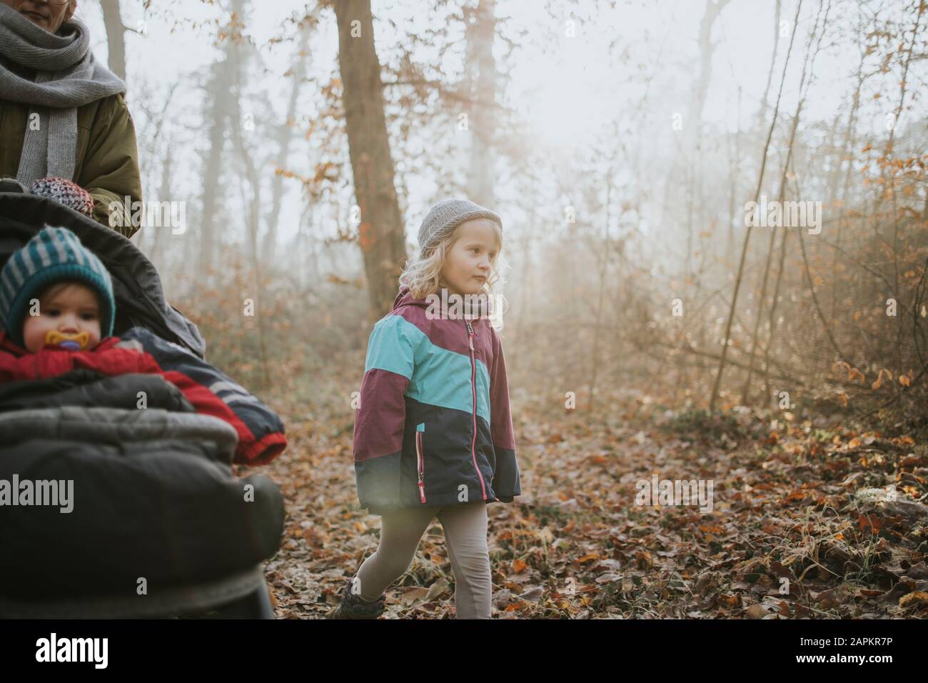 Mother with daughters during forest walk in autumn Stock Photo - Alamy