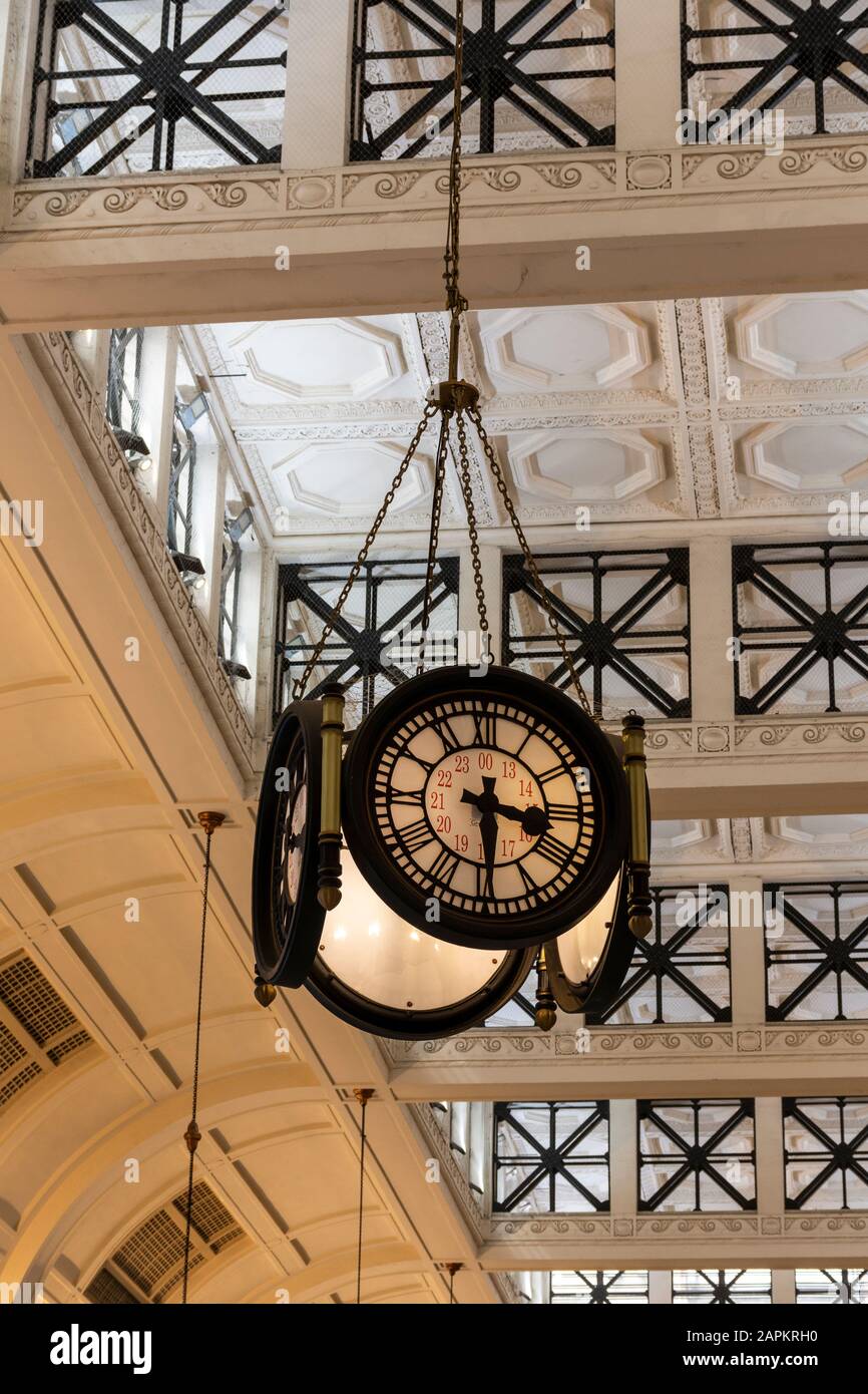 Interior of big old Central Station train terminal building with clock ...