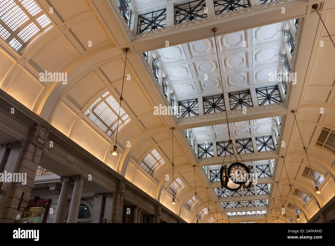 Interior of big old Central Station train terminal building with clock ...