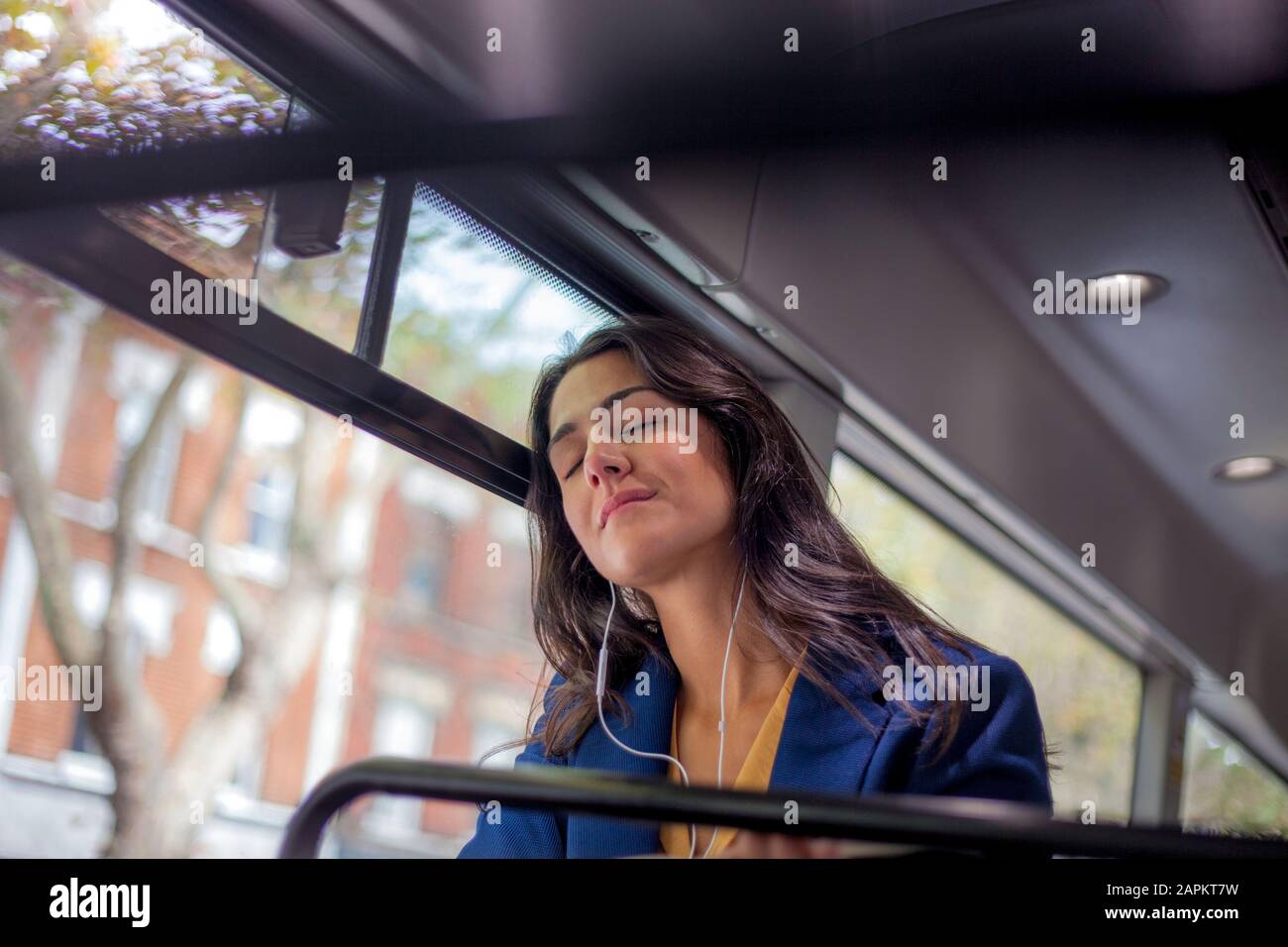 Woman relaxed bus eyes closed hi-res stock photography and images - Alamy