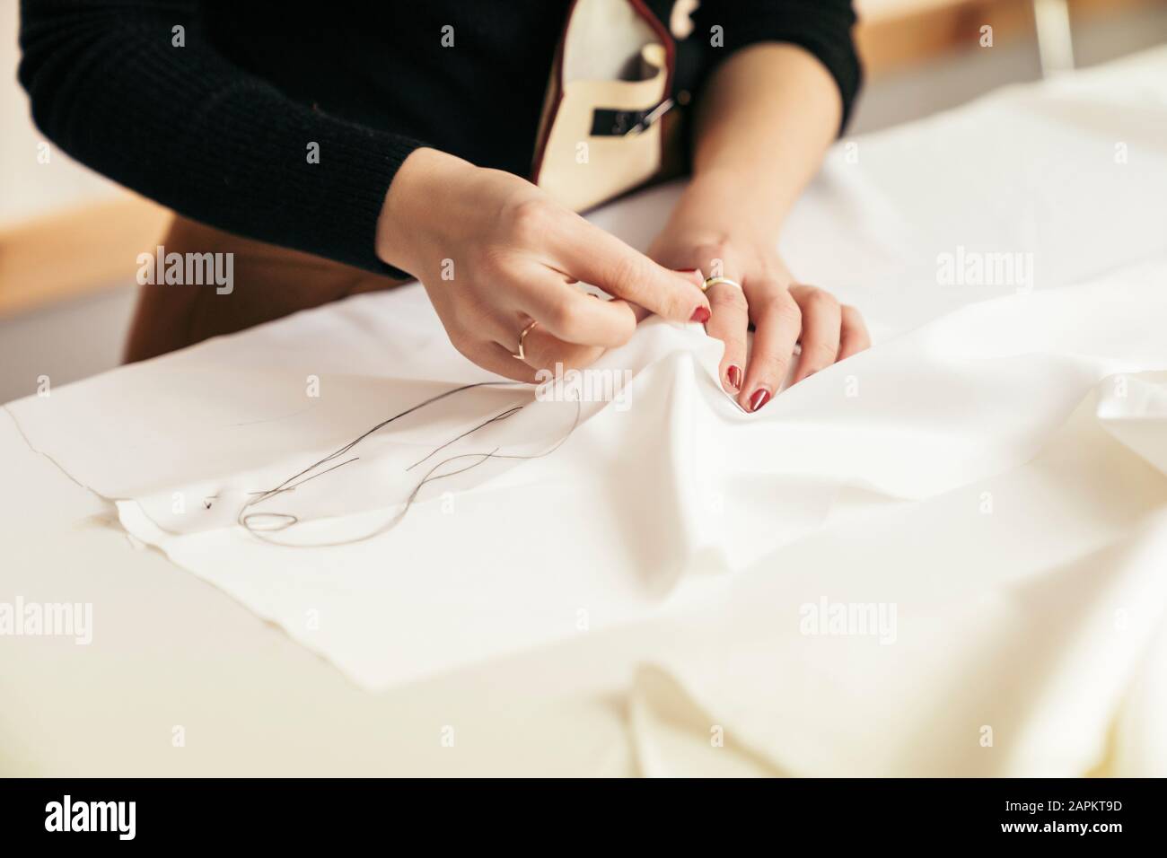 Fashion designer's hands at work Stock Photo - Alamy