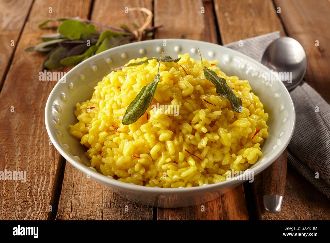 Saffron risotto with sage leaves Stock Photo - Alamy