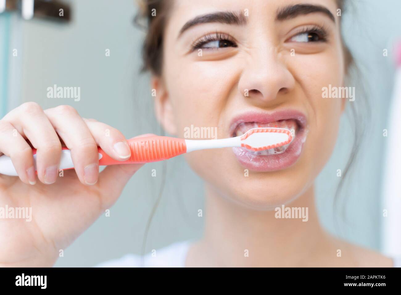 Woman brushing teeth Stock Photo - Alamy