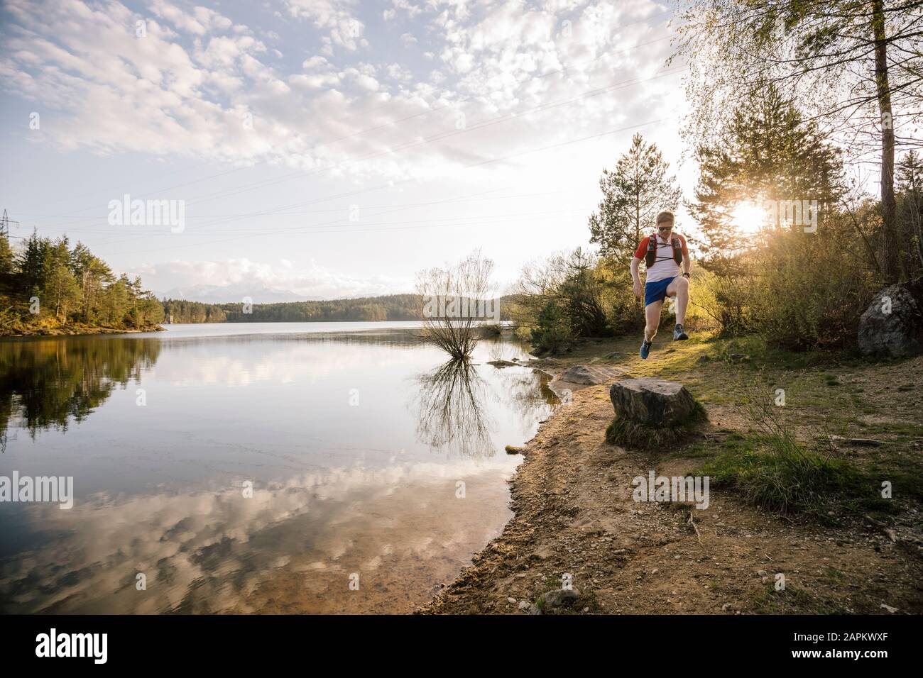 Back view man running lake hi-res stock photography and images - Alamy