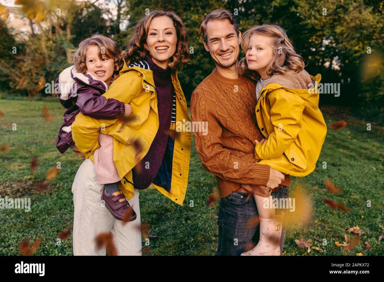 Portrait of happy family with two daughters outdoors in autumn Stock ...