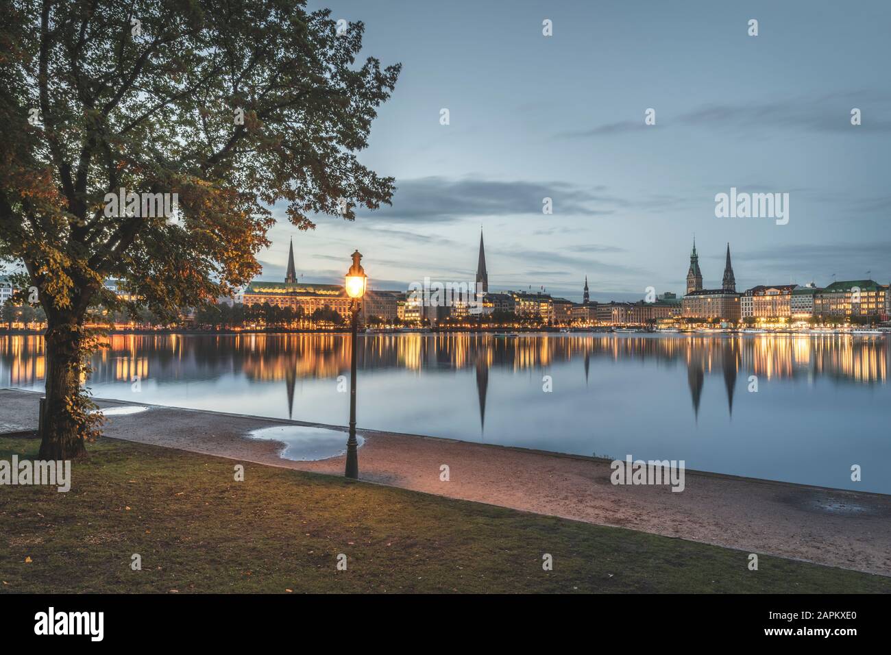 Germany, Hamburg, Waterfront buildings reflecting in Inner Alster Lake ...