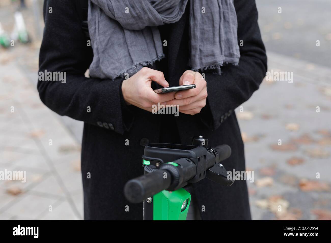 Crop view of man scanning QR Code for activating rental electric ...