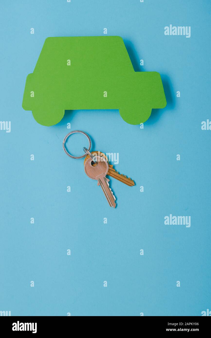 paper green cars figure with keys. top view on blue background Stock ...