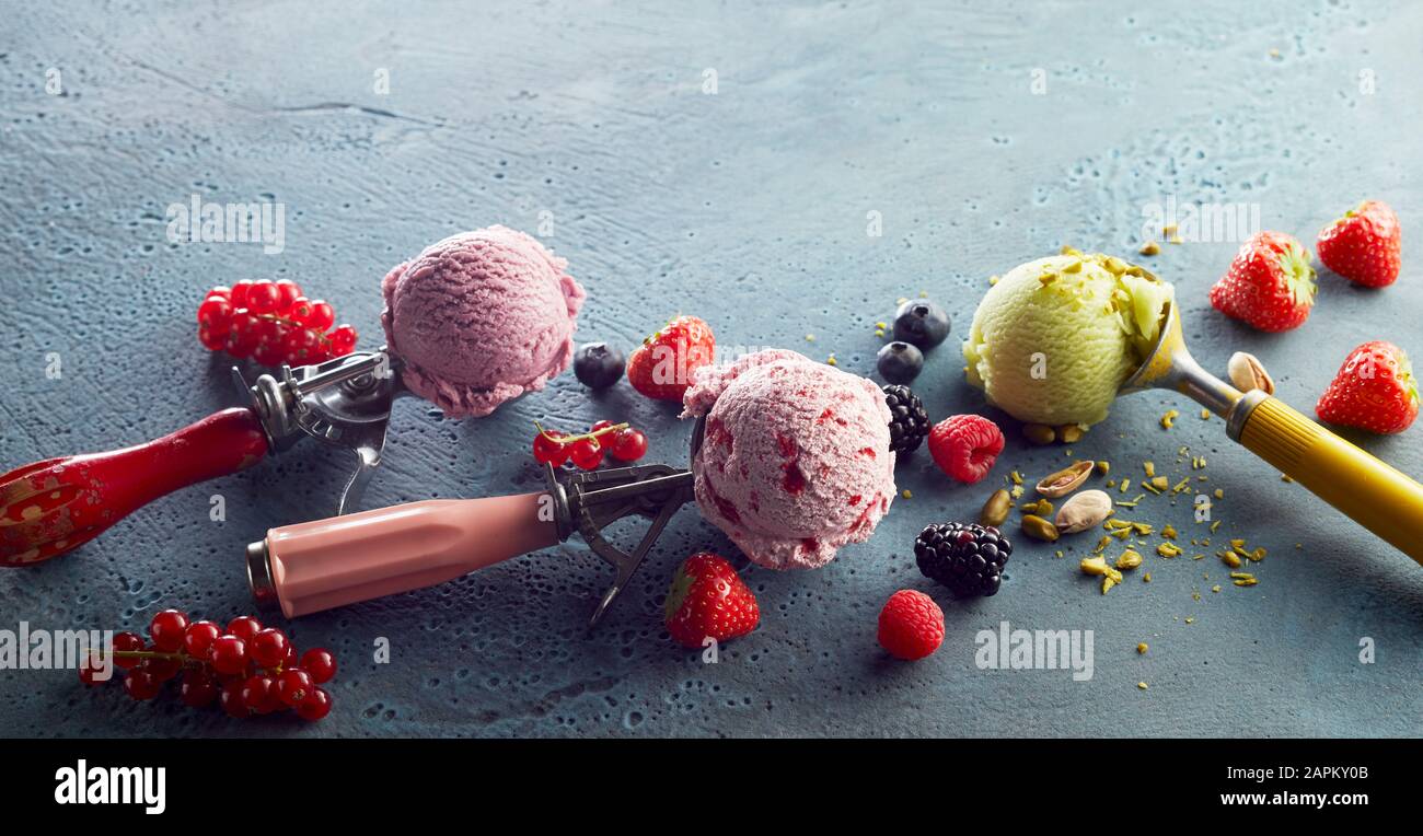 Assorted ice cream on scoop and fresh fruits Stock Photo - Alamy