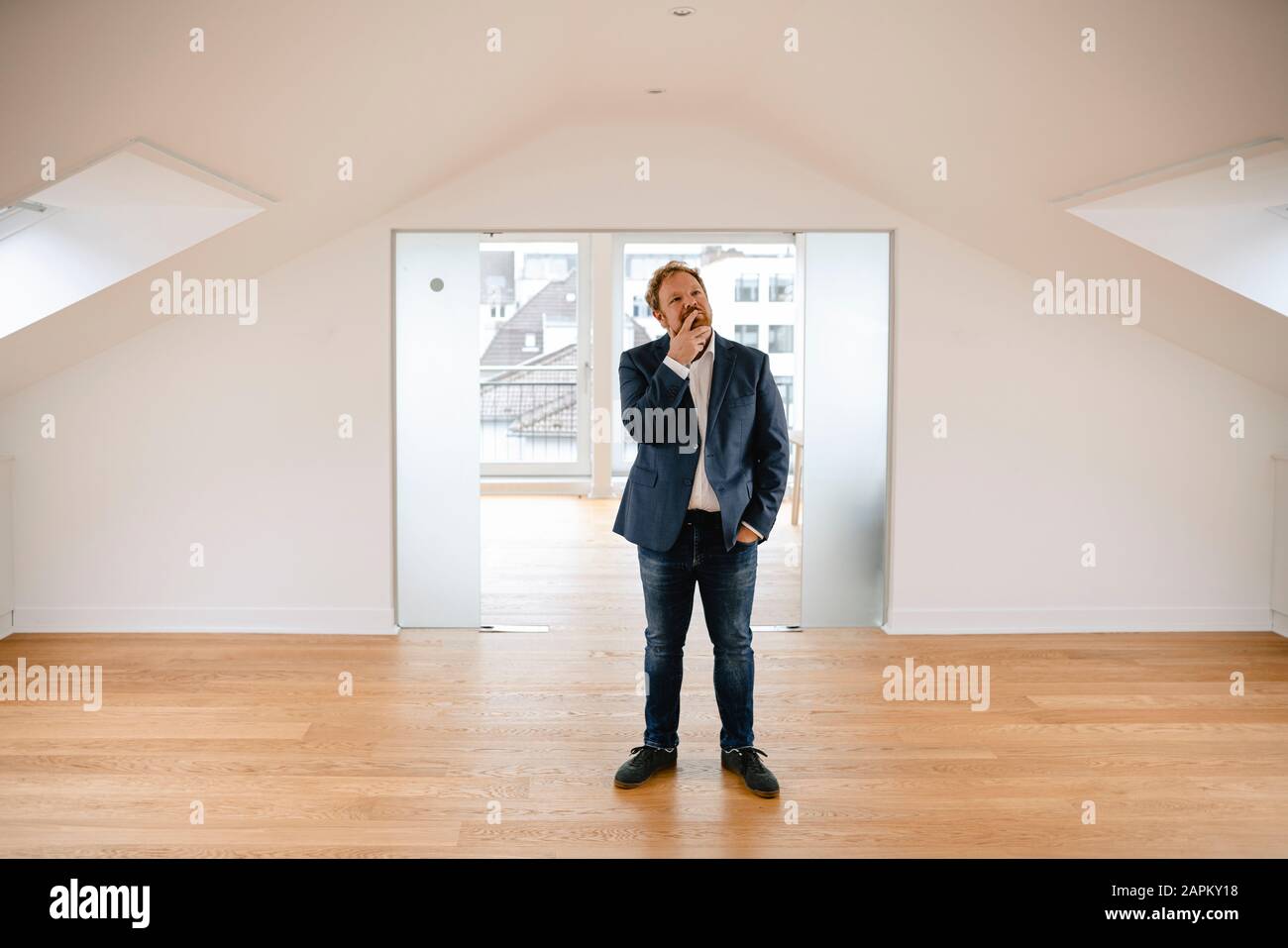 Standing around buildings hi-res stock photography and images - Alamy