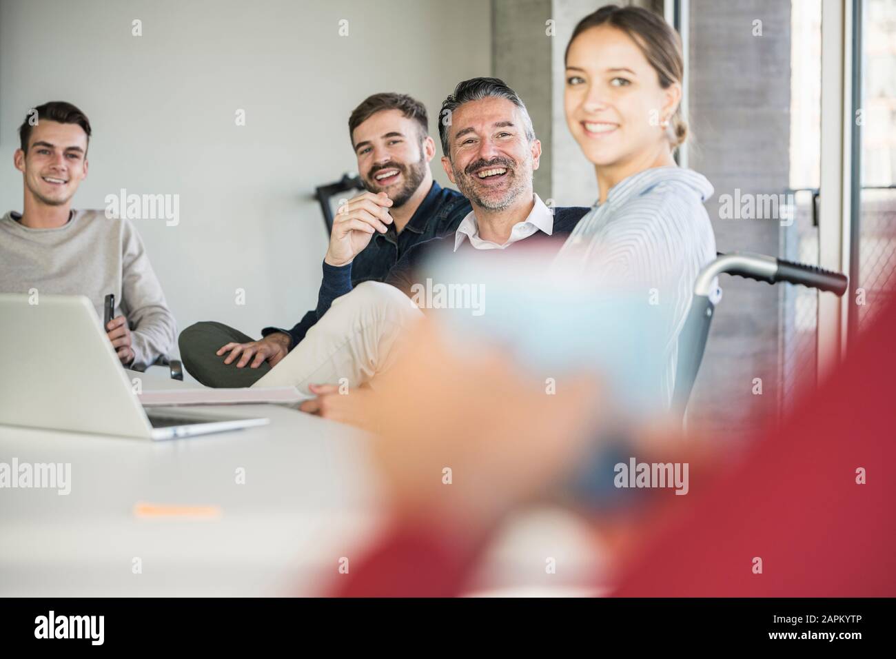 Happy employees working office setting hi-res stock photography and ...
