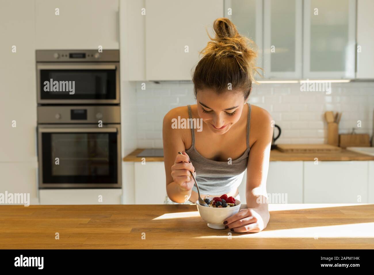 Female teenager during breakfast in the kitchen Stock Photo - Alamy