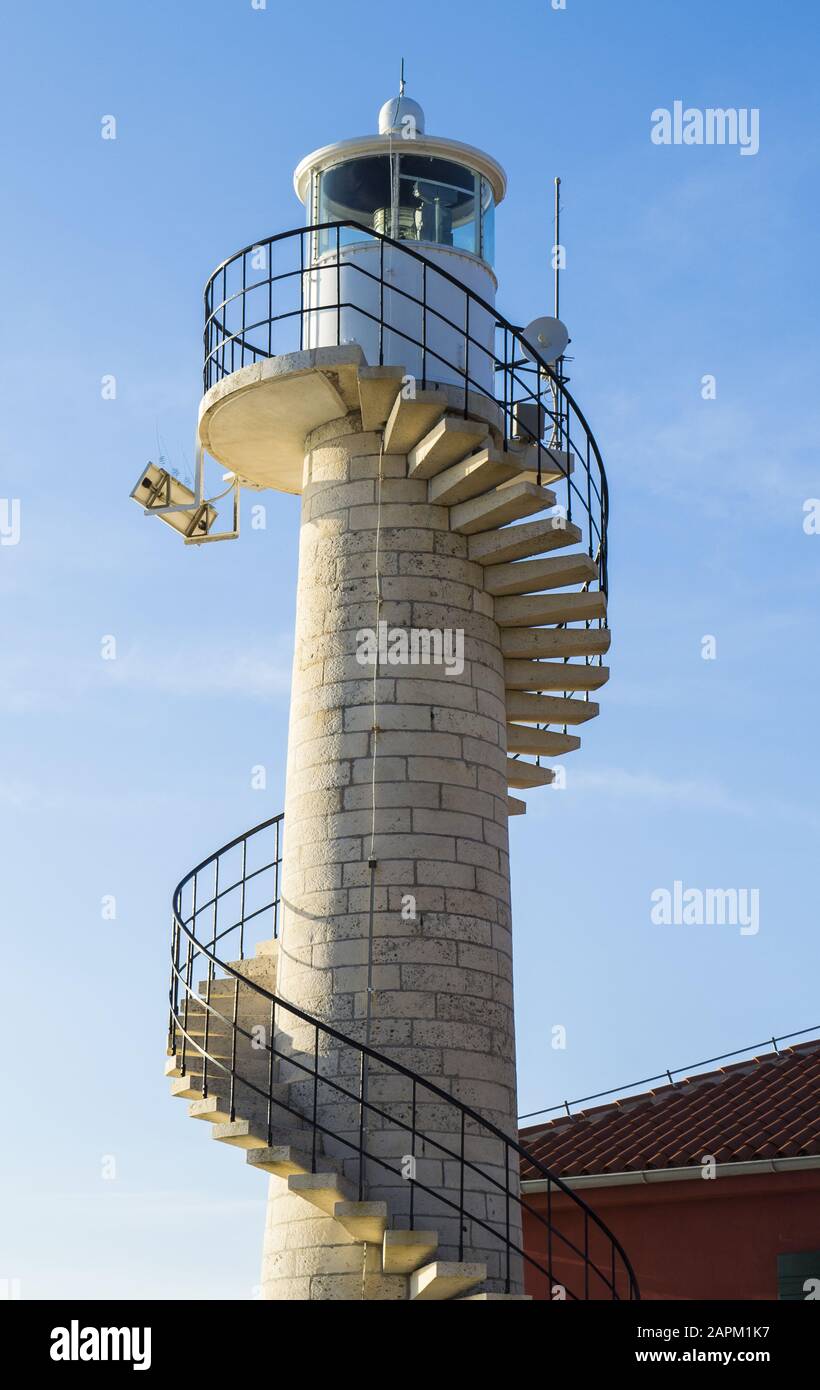 Vertical shot of a lighthouse at Beach Bar Bamboo in Zadar Croatia ...