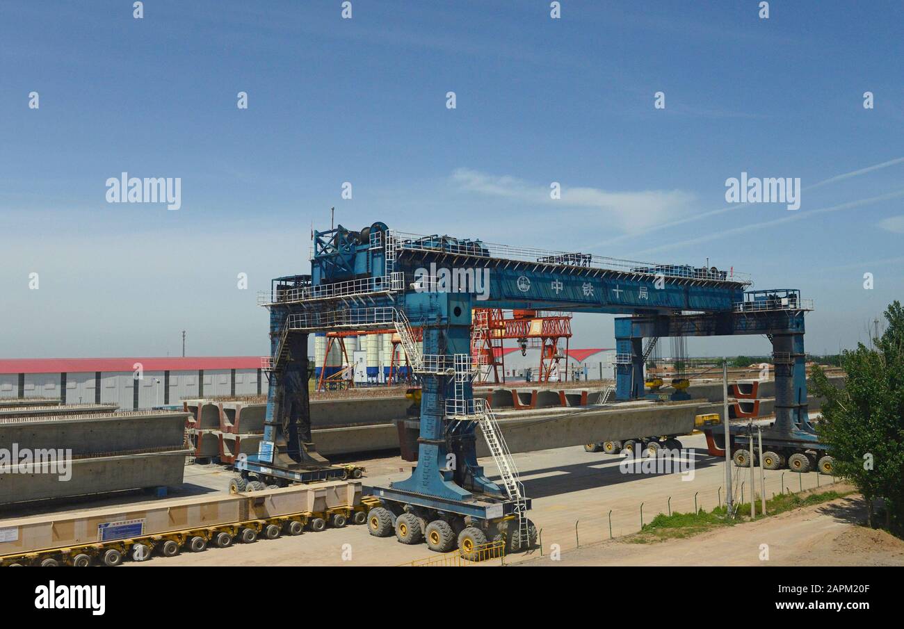 Elevated precast trackbed components with lifter at a construction ...