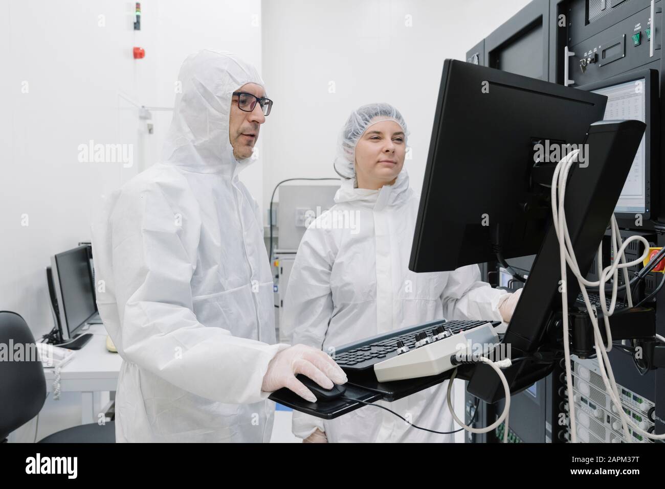 Two scientists using computer in laboratory of science center Stock ...