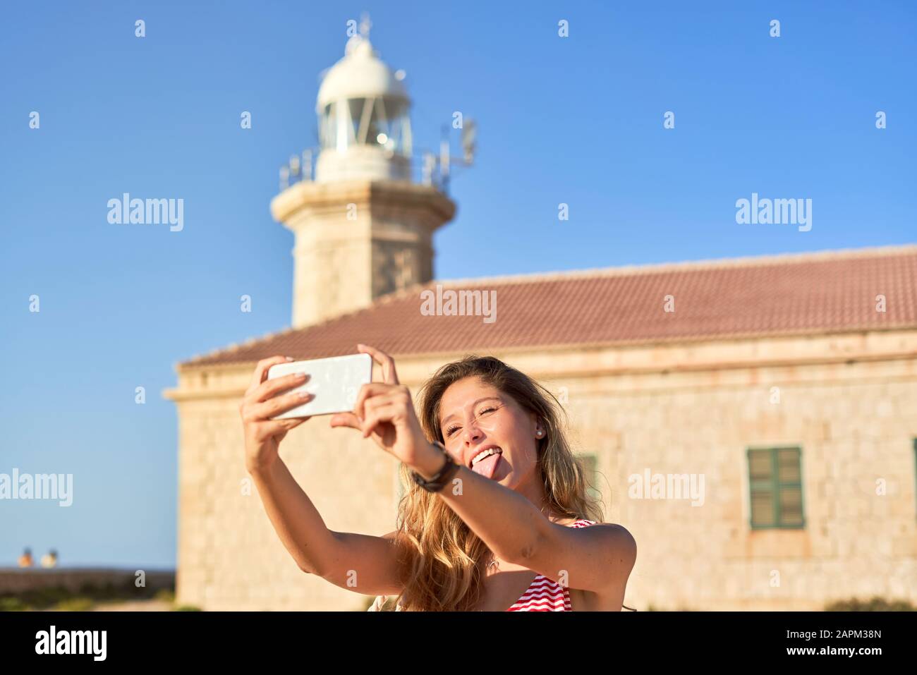 Woman photographing lighthouse hi-res stock photography and images - Alamy